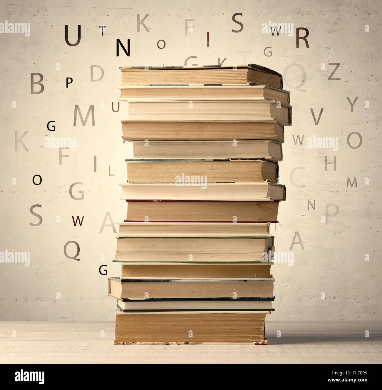 Books with flying letters on vintage background Stock Photo - Alamy