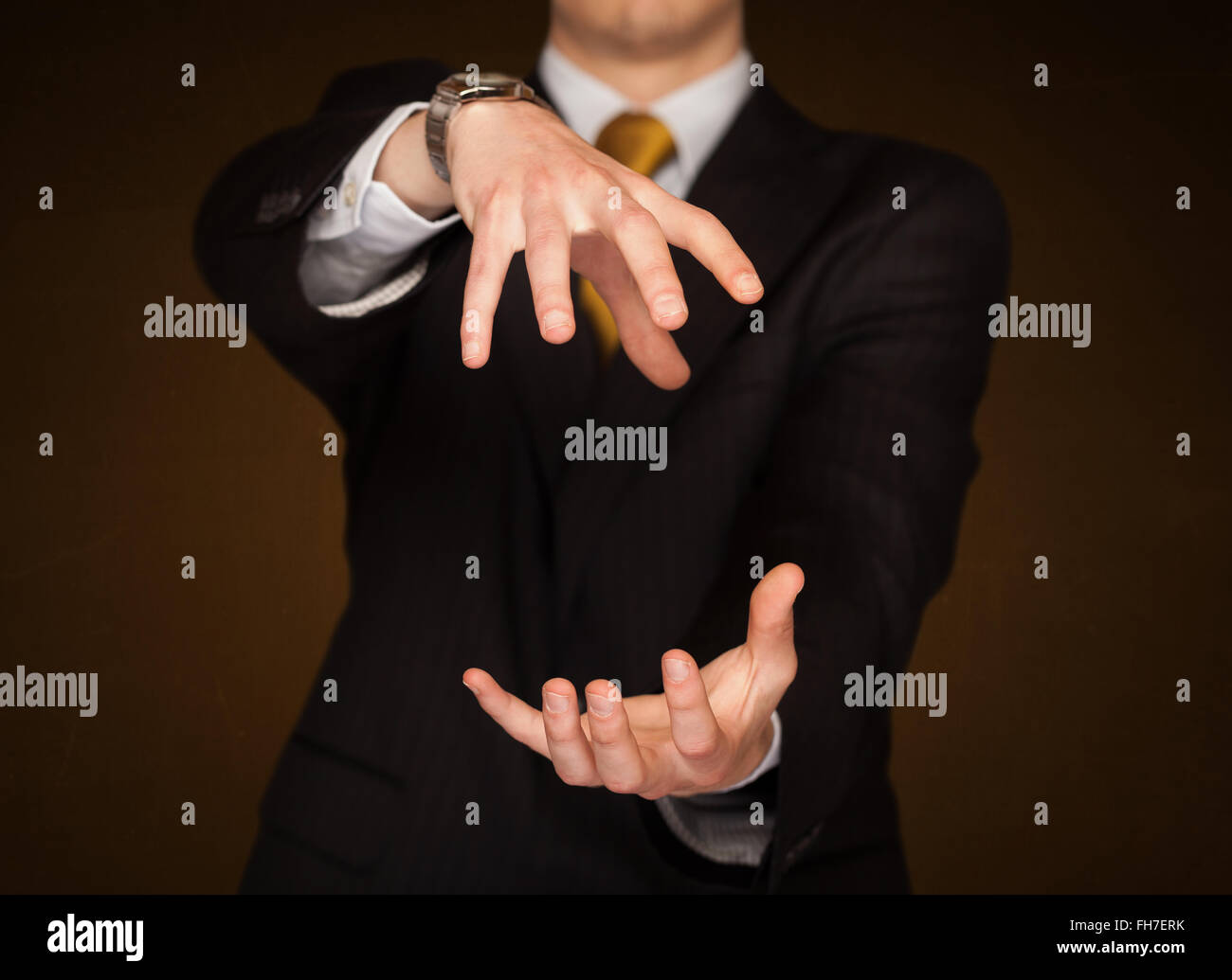 Businessman holding something Stock Photo - Alamy