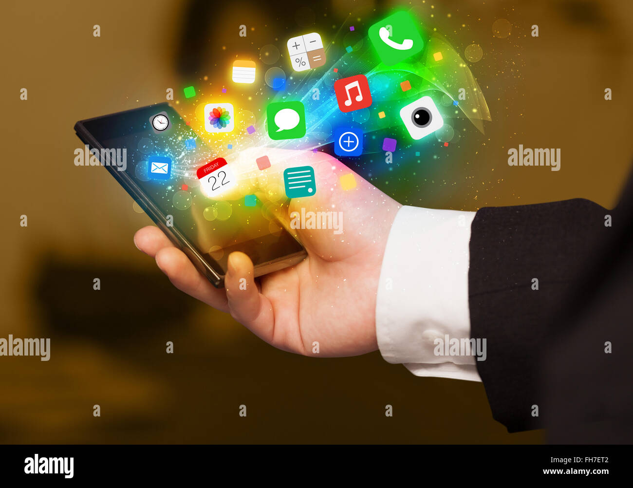 Hand holding smartphone with colorful app icons Stock Photo - Alamy