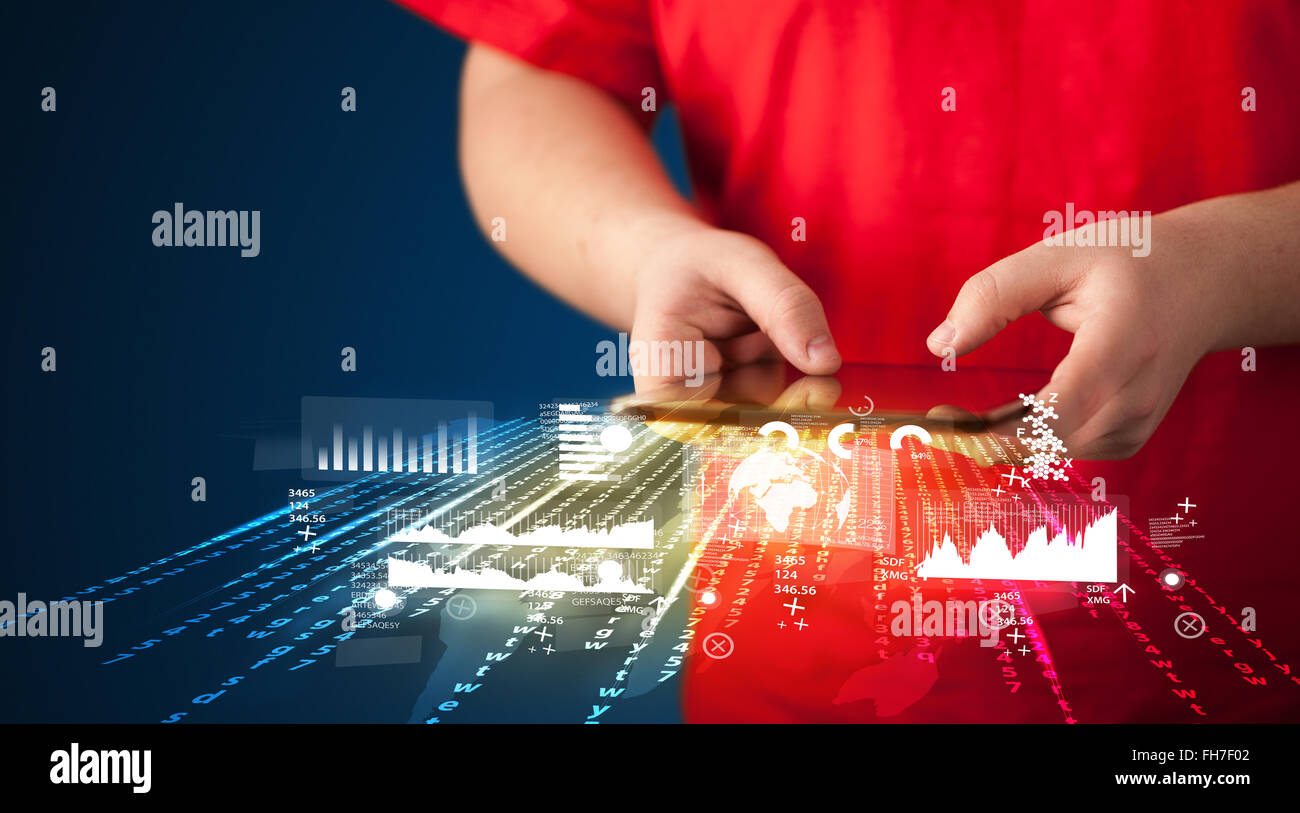 Hand holding touchpad tablet with business market graphs Stock Photo ...