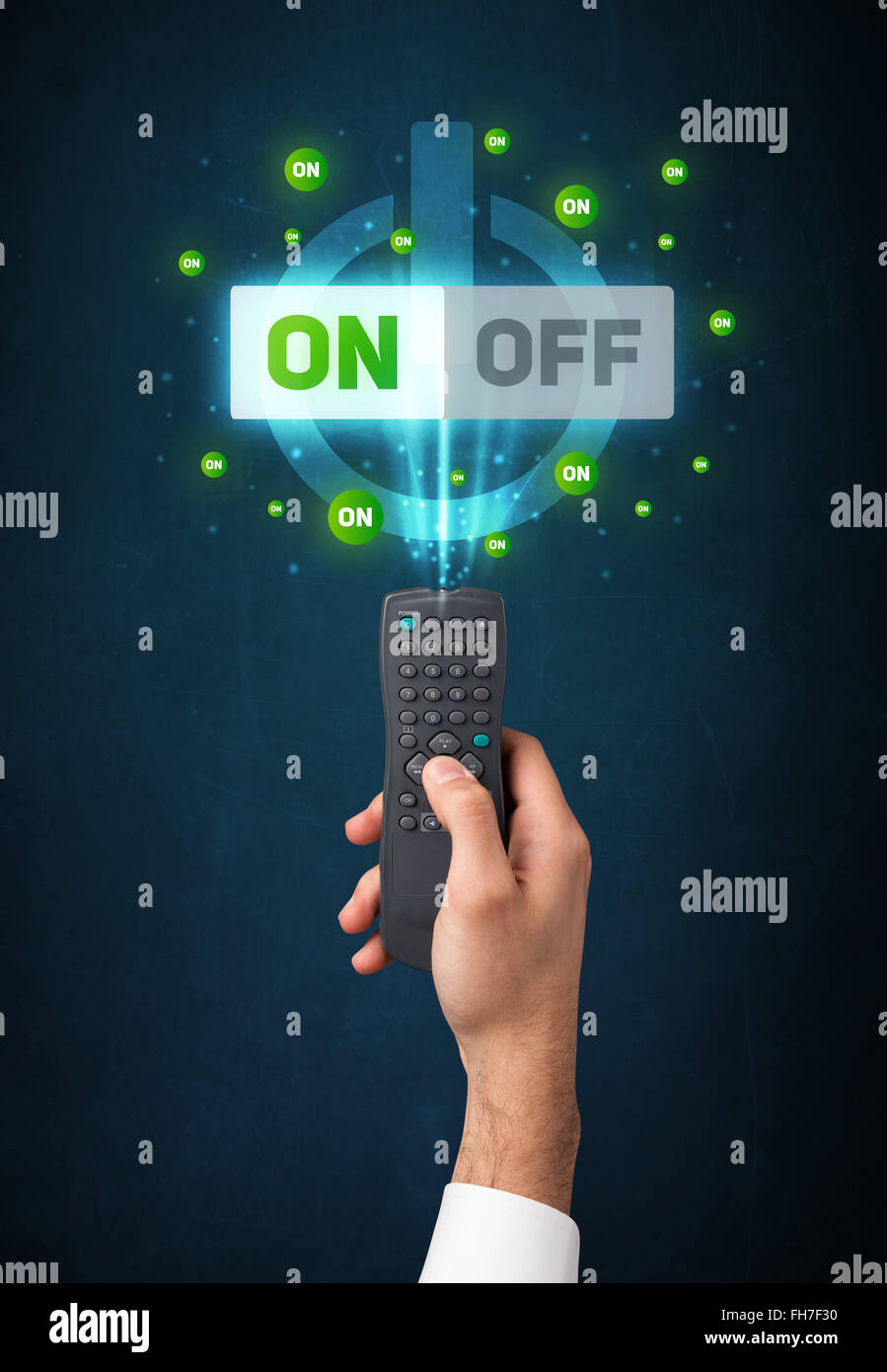 Hand with remote control and on-off signals Stock Photo - Alamy