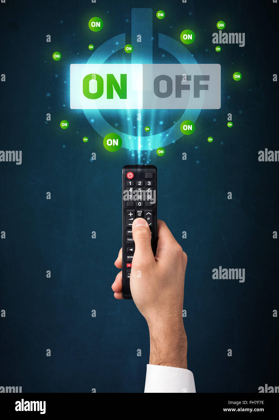 Hand with remote control and on-off signals Stock Photo - Alamy