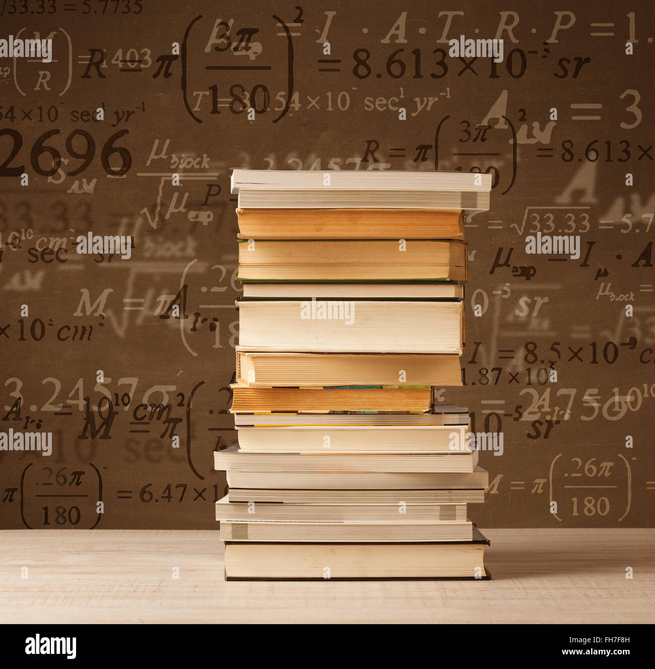 Books on vintage background with math formulas Stock Photo - Alamy