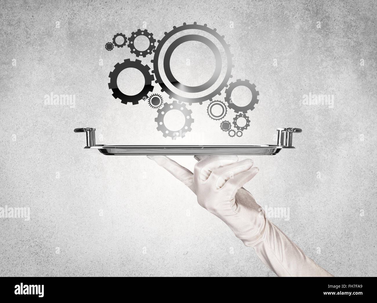 Working cog wheel concept on tray Stock Photo - Alamy
