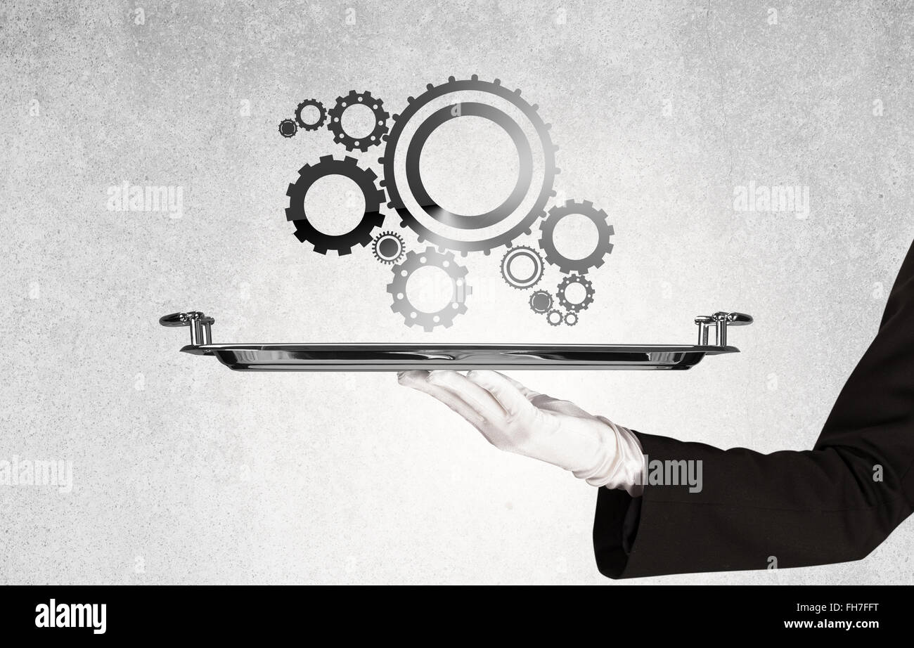 Working cog wheel concept on tray Stock Photo - Alamy