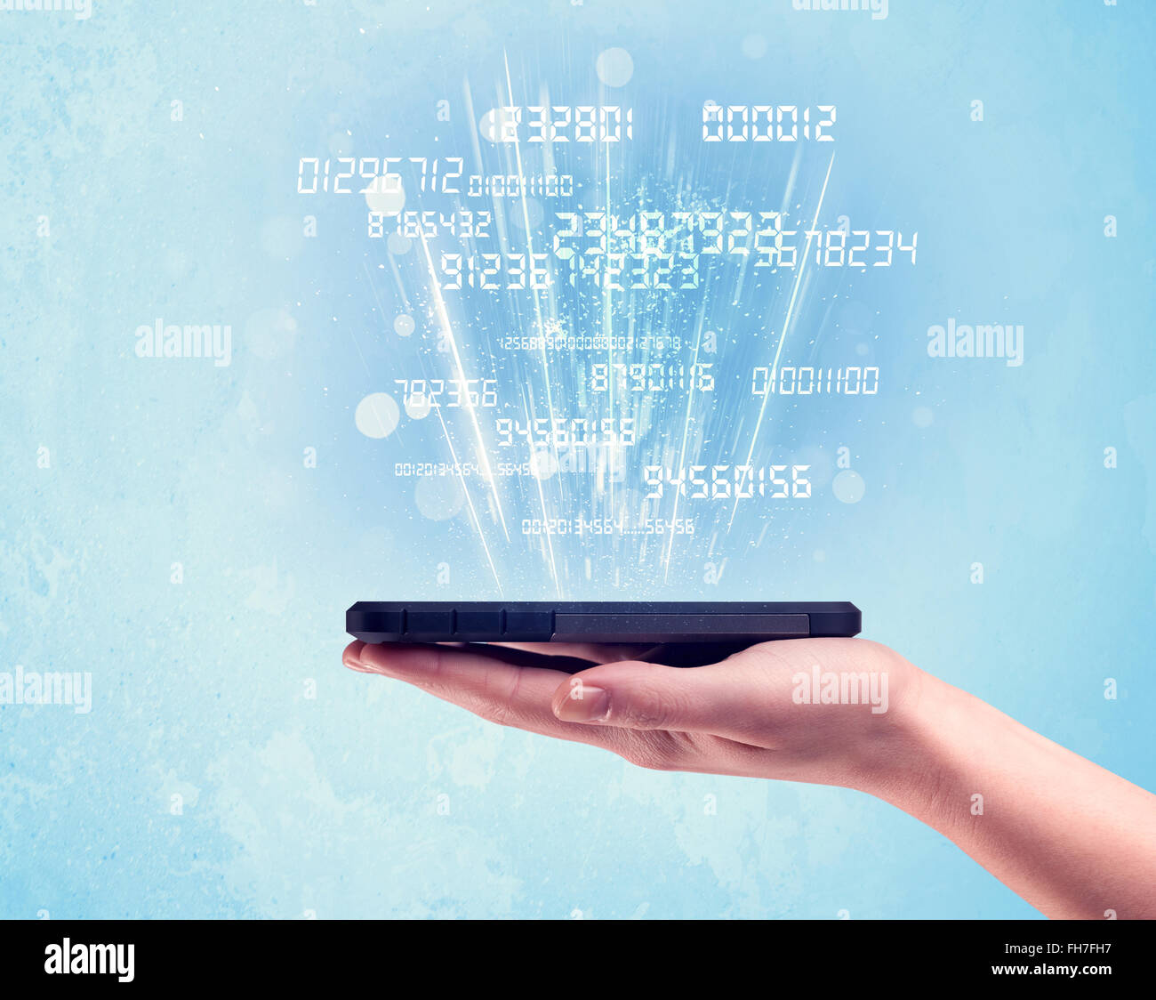 Hand holding phone with digital numbers Stock Photo - Alamy