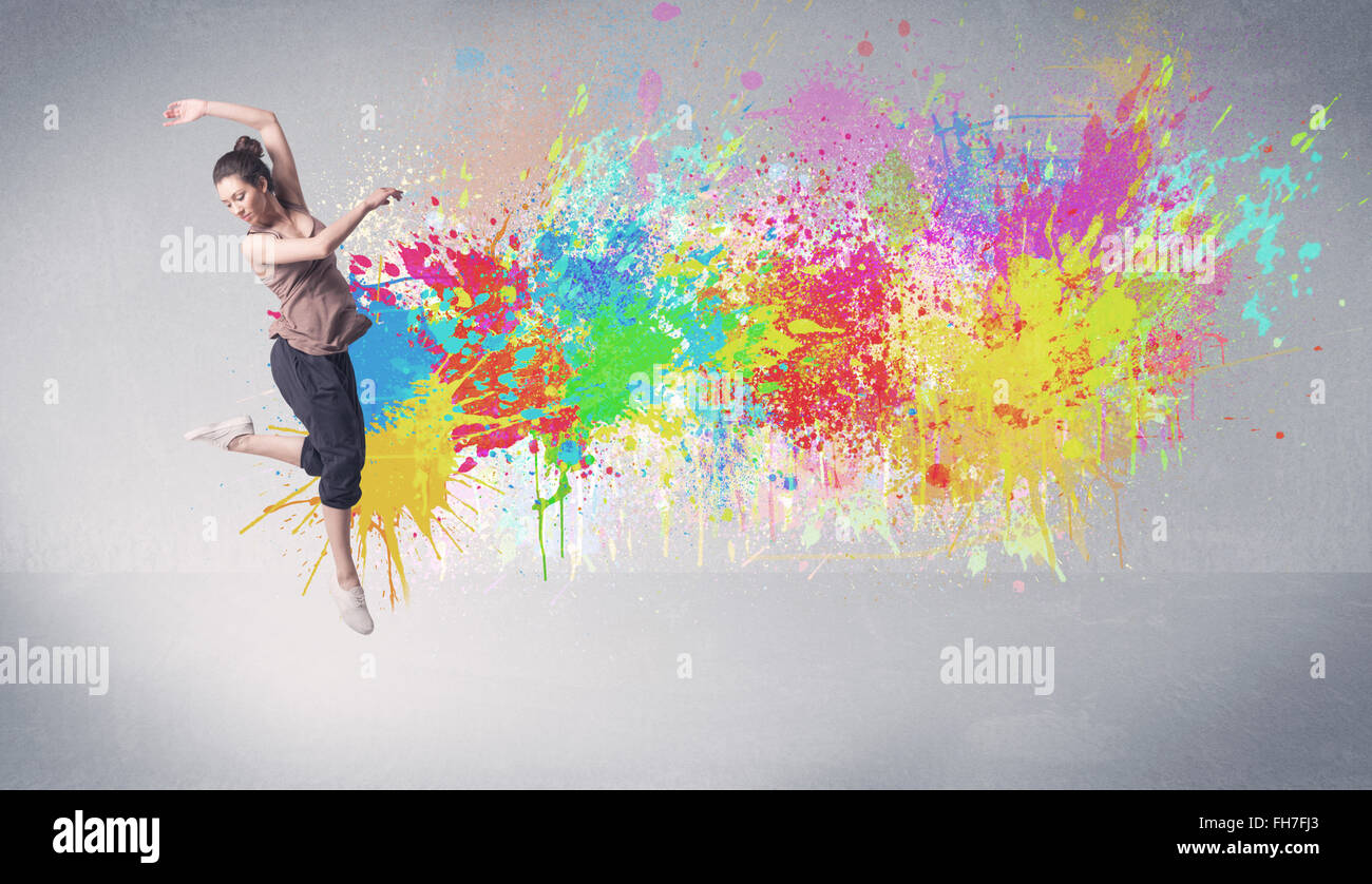 Young colorful street dancer with paint splash Stock Photo - Alamy