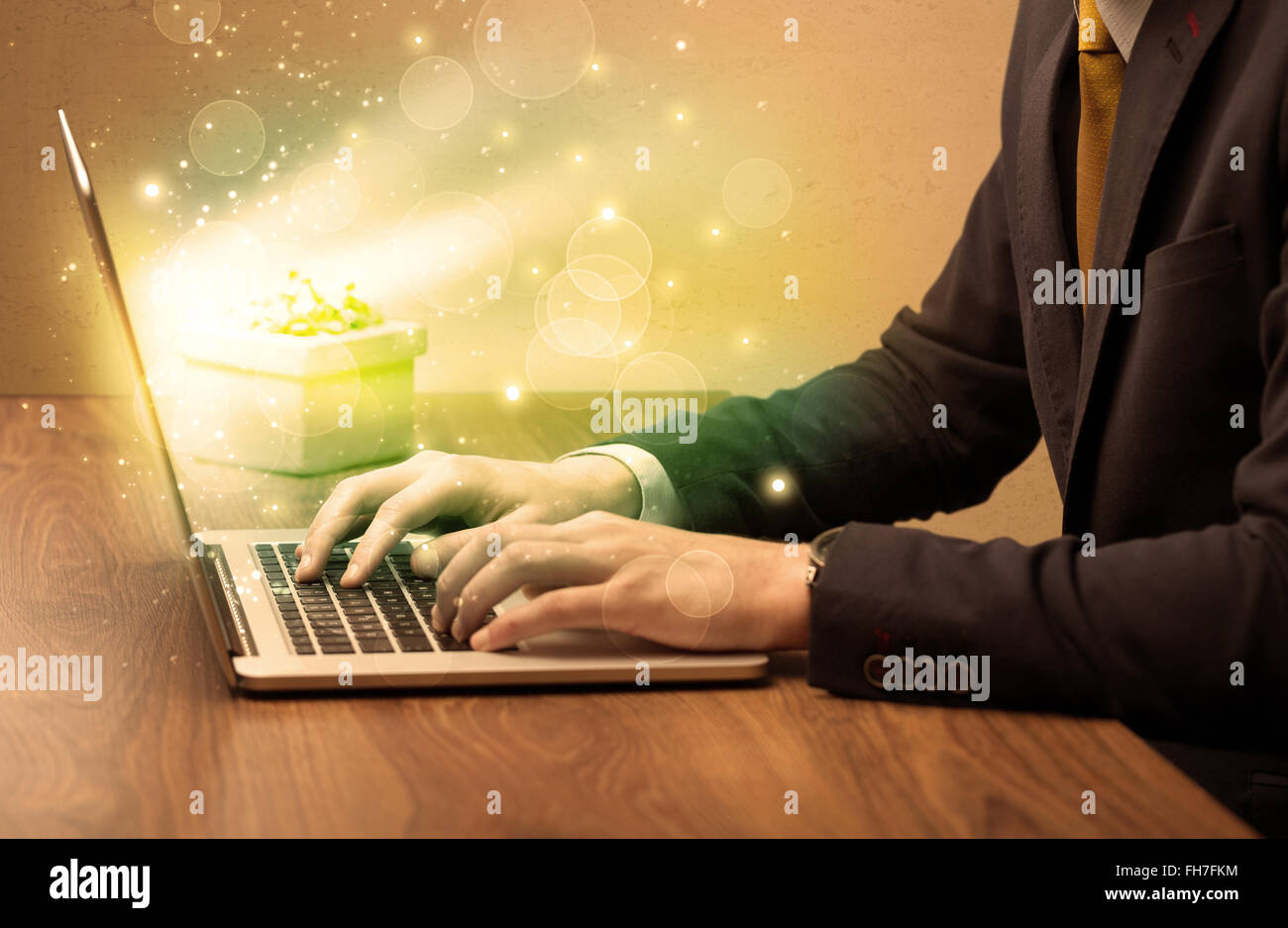 Businessman working fast on laptop Stock Photo - Alamy