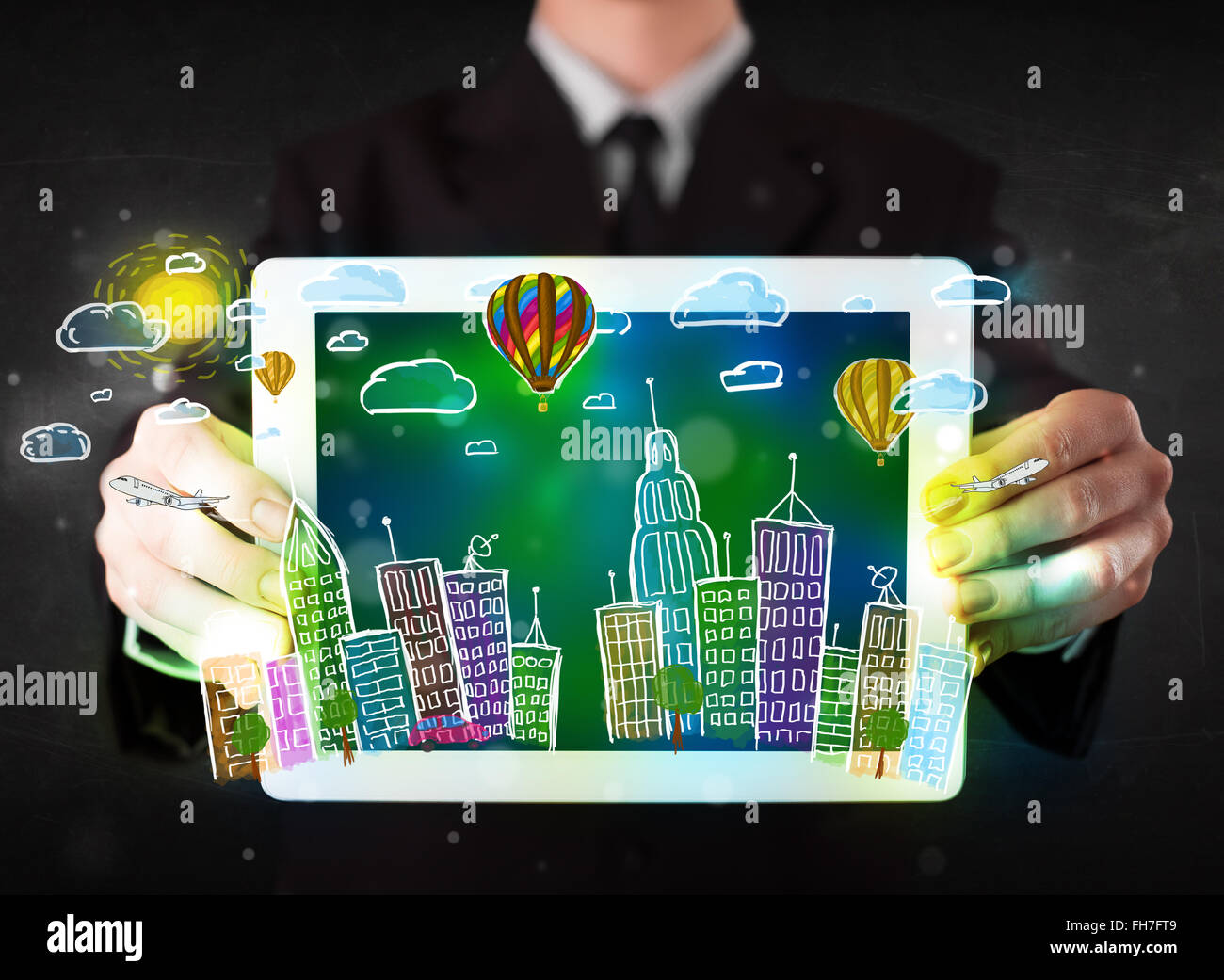 Young person showing tablet with hand drawn cityscape Stock Photo - Alamy