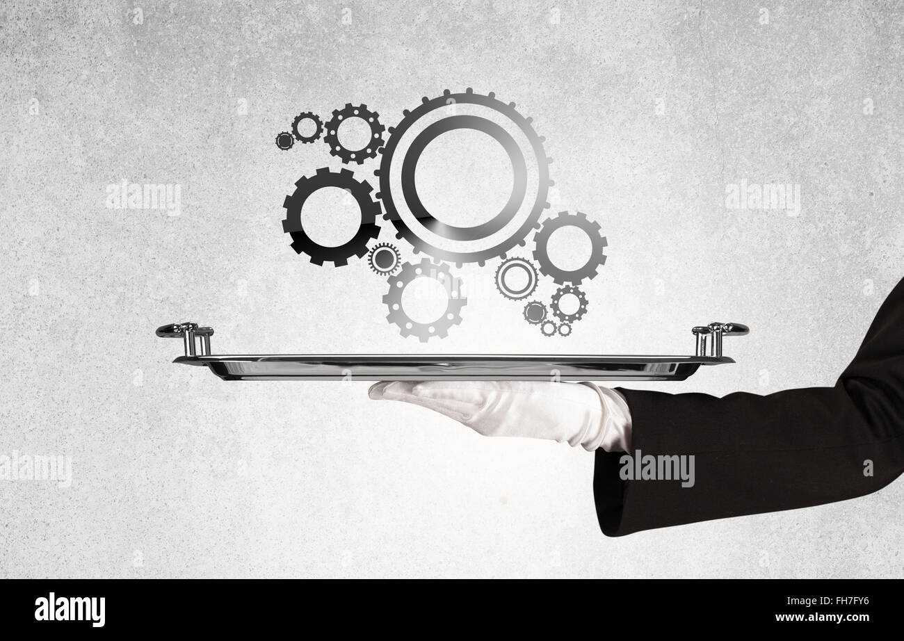 Working cog wheel concept on tray Stock Photo - Alamy