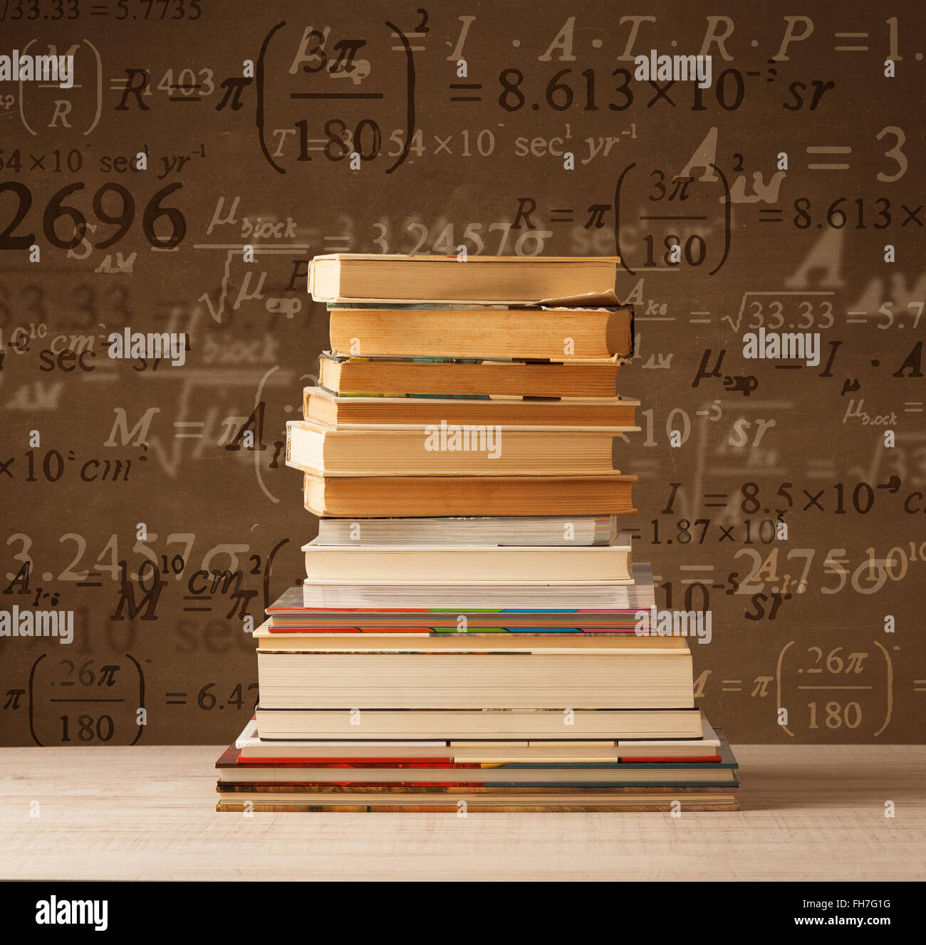 Books on vintage background with math formulas Stock Photo - Alamy