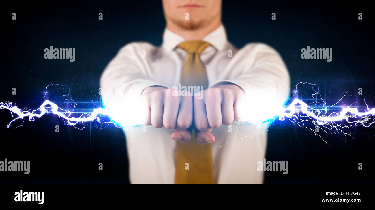 Business man holding electricity light bolt in his hands Stock Photo ...