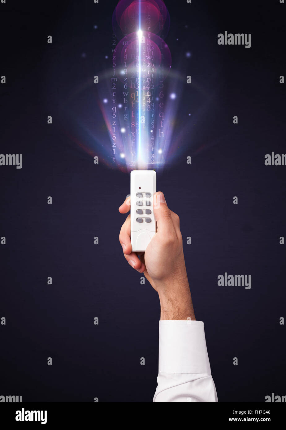 Hand with remote control and shining numbers Stock Photo - Alamy
