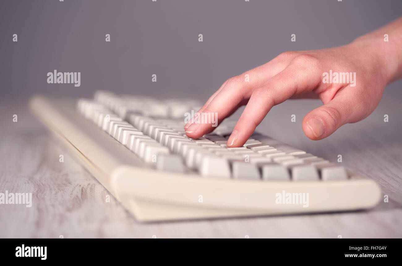 Close up of hand pressing keyboard buttons Stock Photo - Alamy