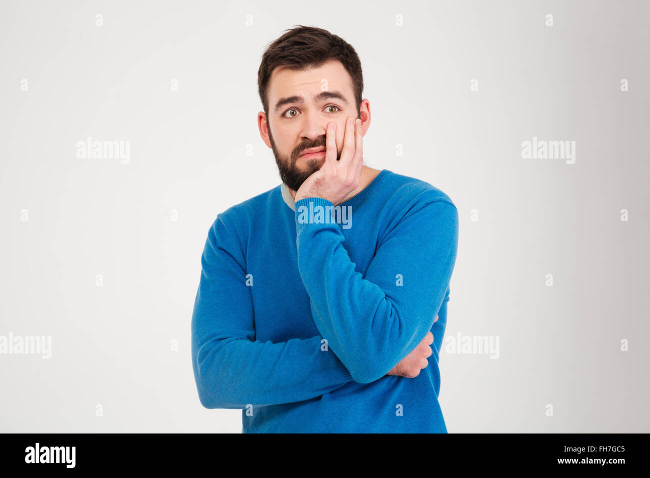 Sad man standing isolated on a white background Stock Photo - Alamy