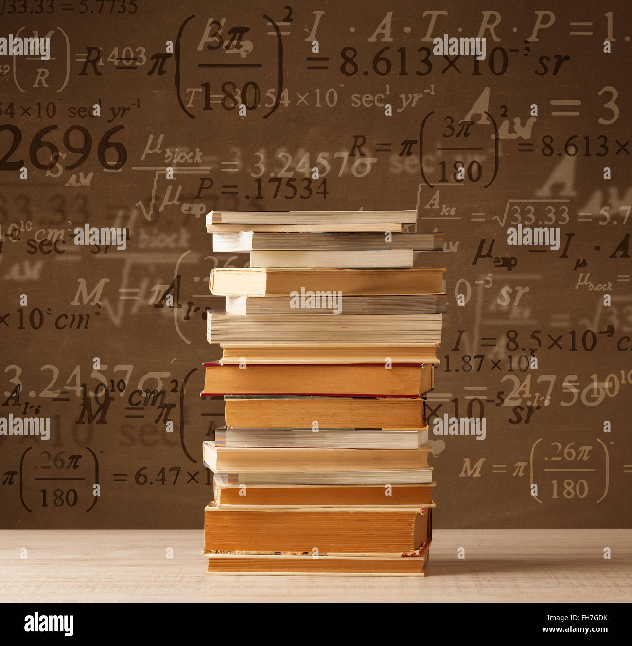 Books on vintage background with math formulas Stock Photo - Alamy