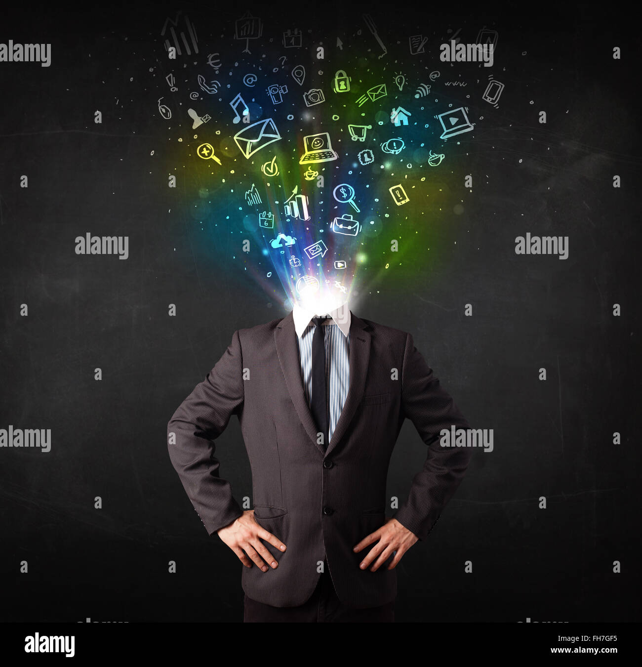 Business man with glowing media icons exploding head Stock Photo - Alamy