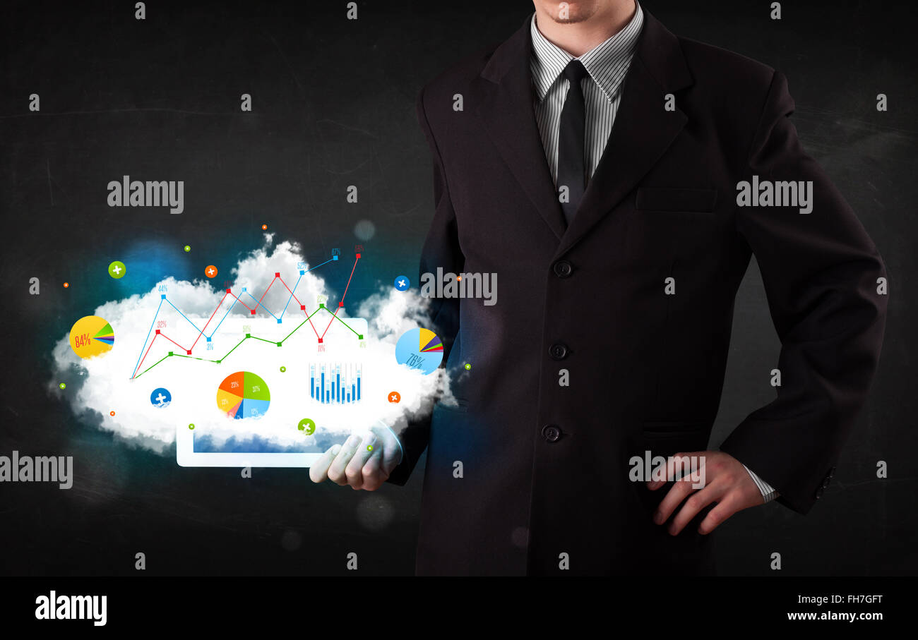 Person holding a touchpad with cloud technology and charts Stock Photo ...