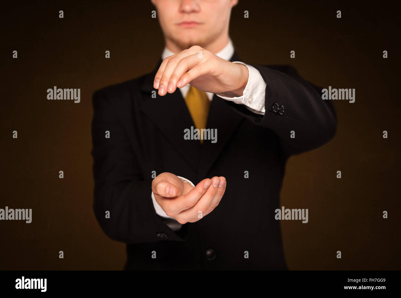 Businessman holding something Stock Photo - Alamy