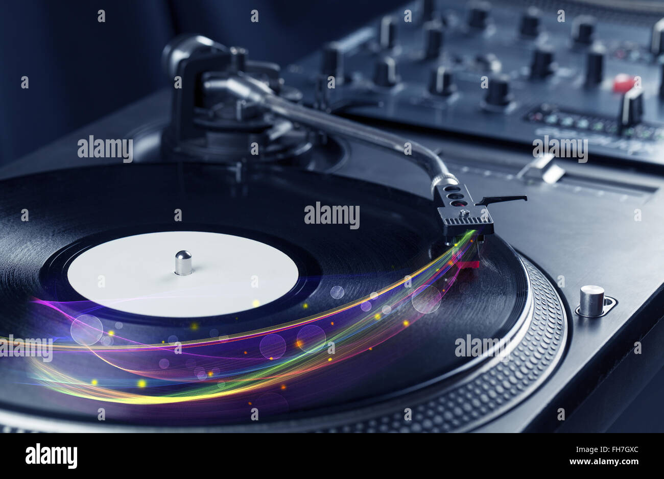 Turntable playing vinyl with glowing abstract lines Stock Photo - Alamy