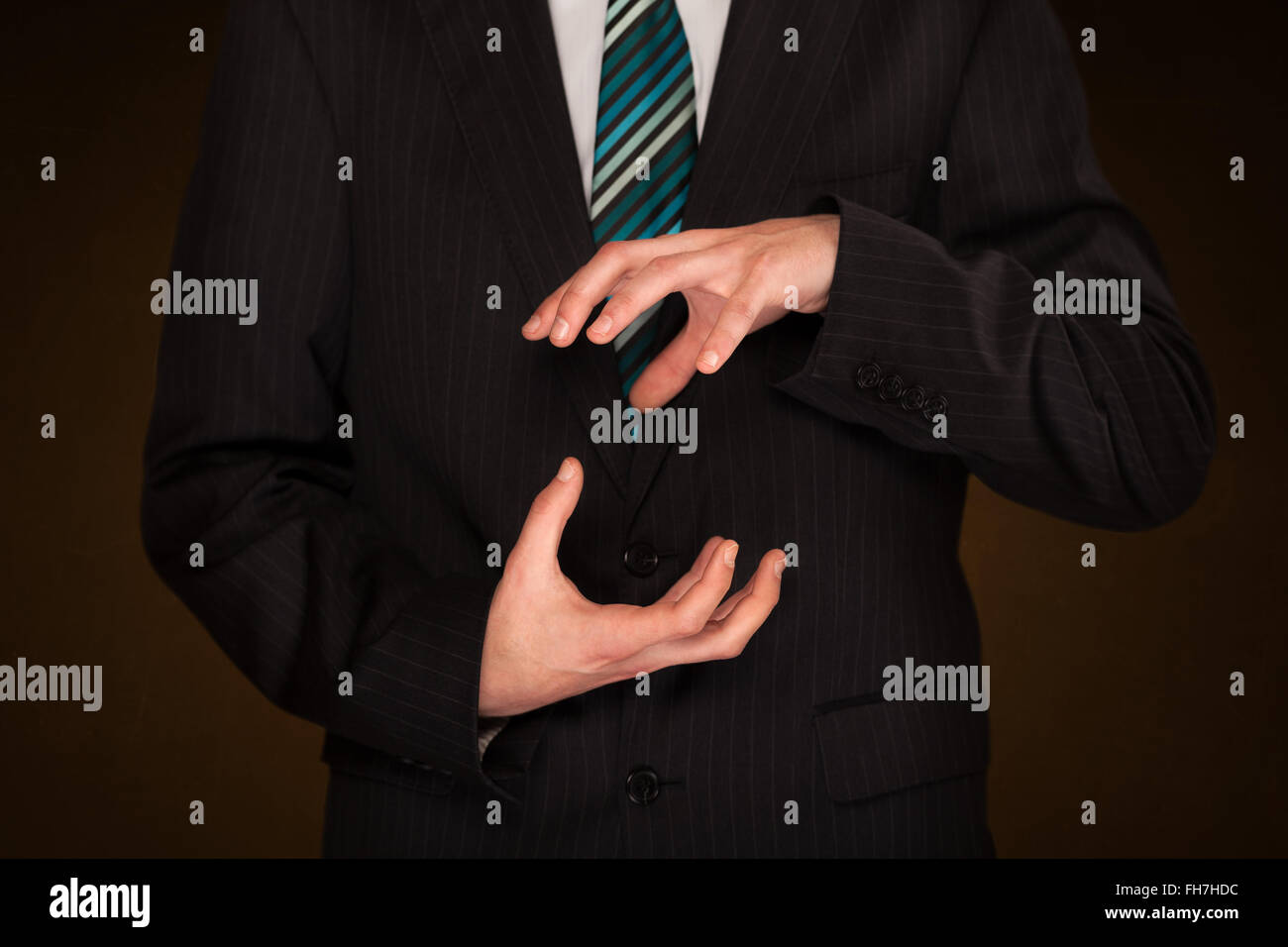 Businessman holding something Stock Photo - Alamy