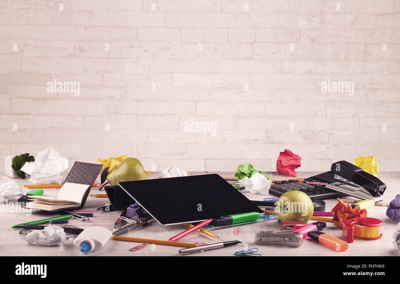 Office desk closeup with white brick wall Stock Photo - Alamy