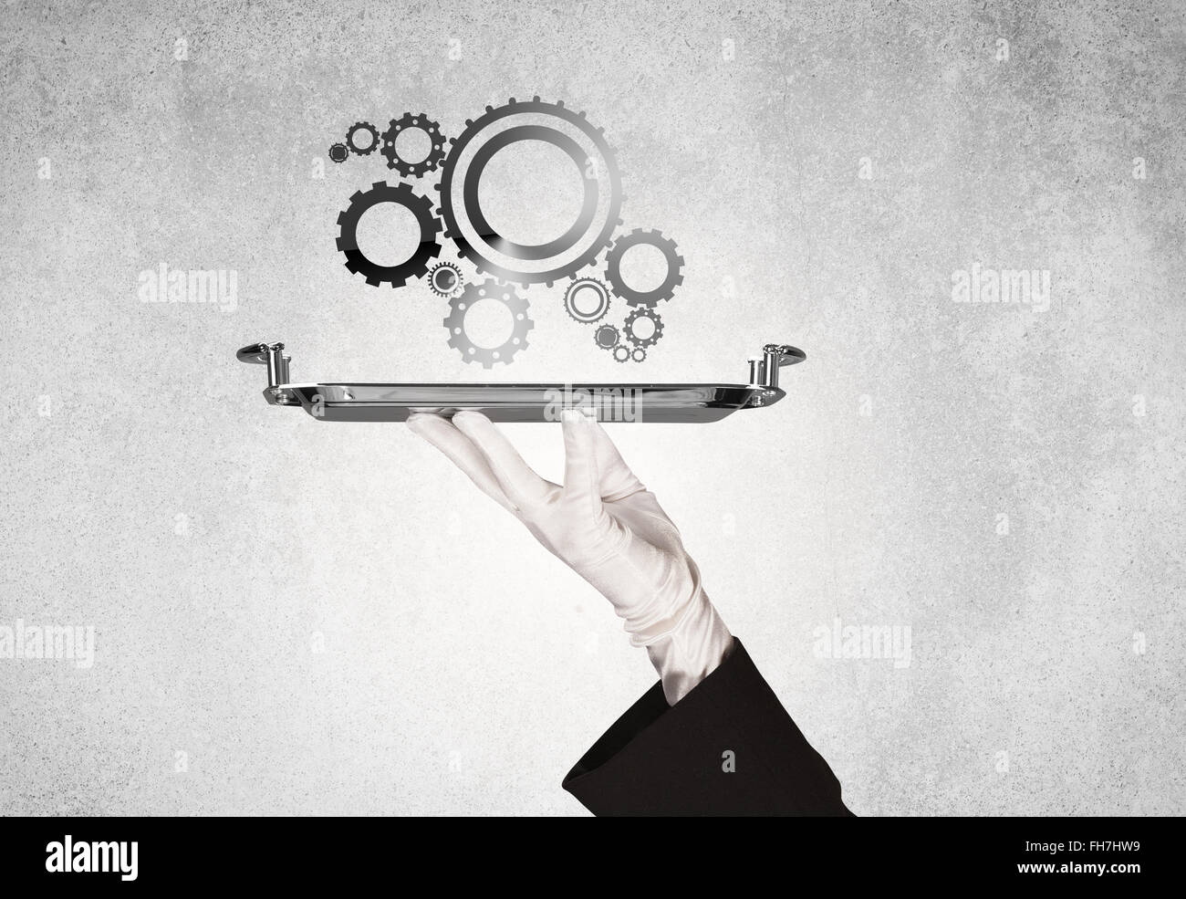 Working cog wheel concept on tray Stock Photo - Alamy
