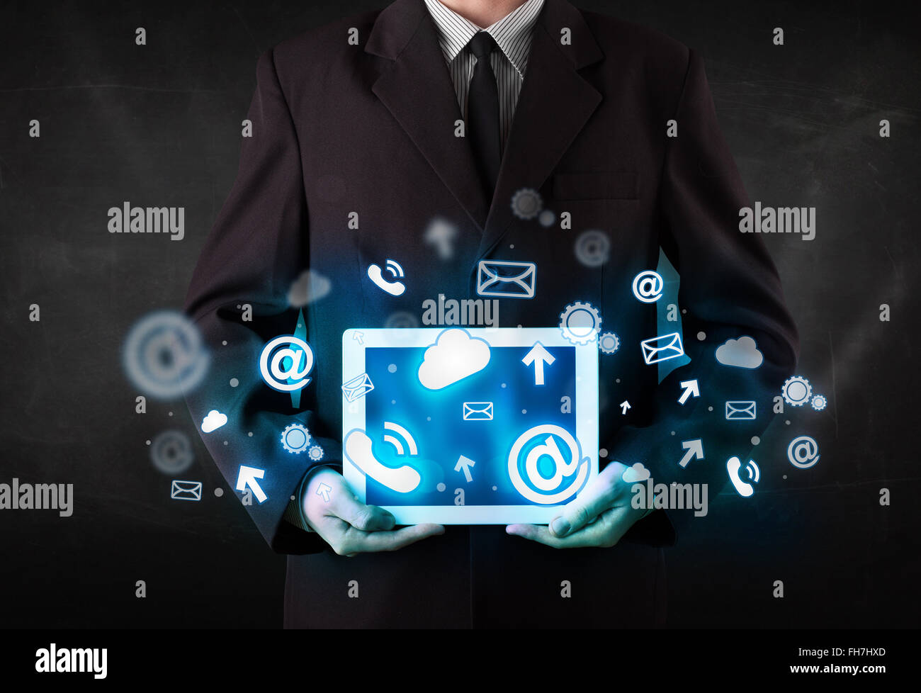 Person holding a tablet with blue technology icons and symbols Stock ...