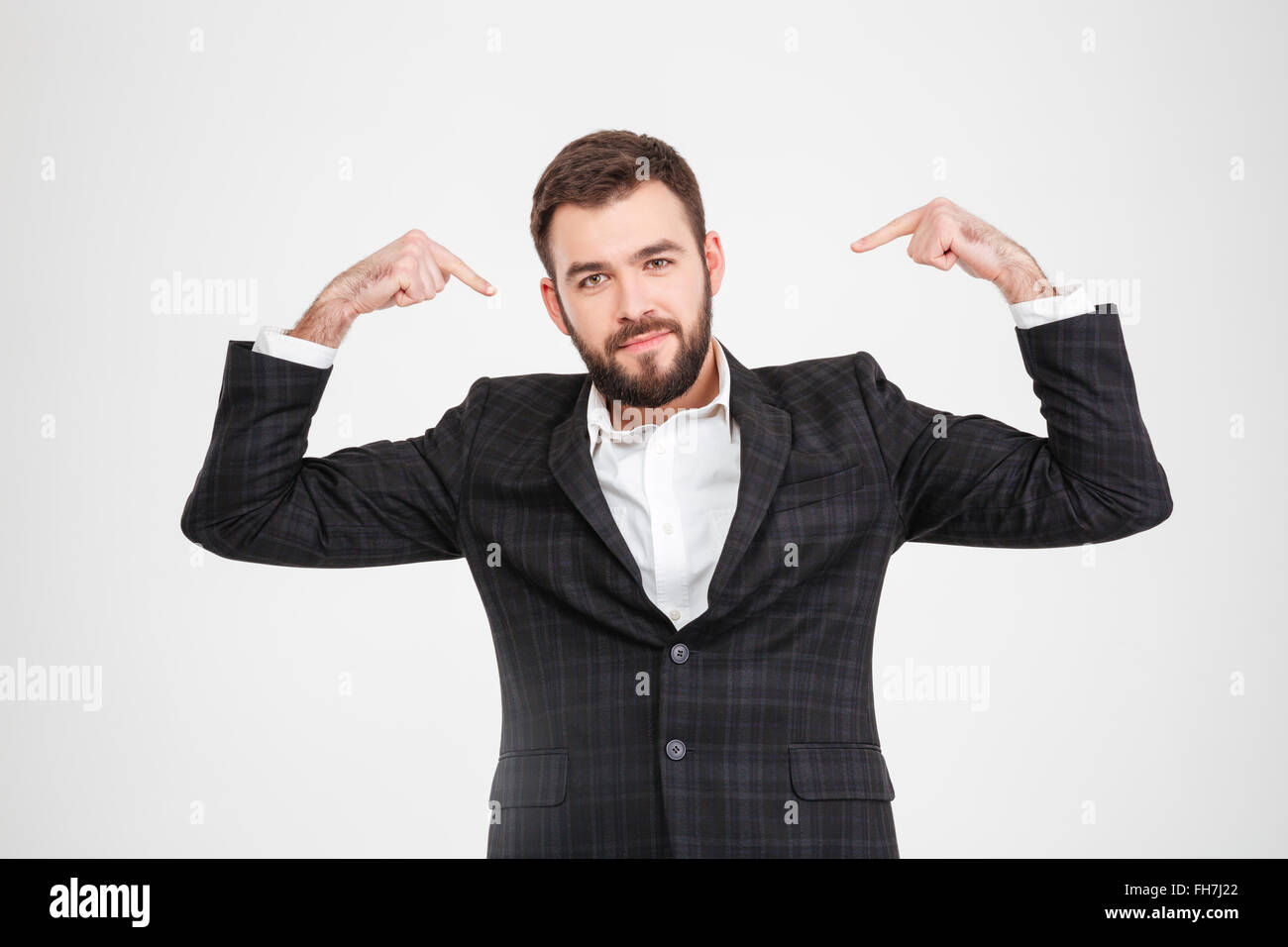 Proud businessman pointing fingers at herself isolated on a white ...