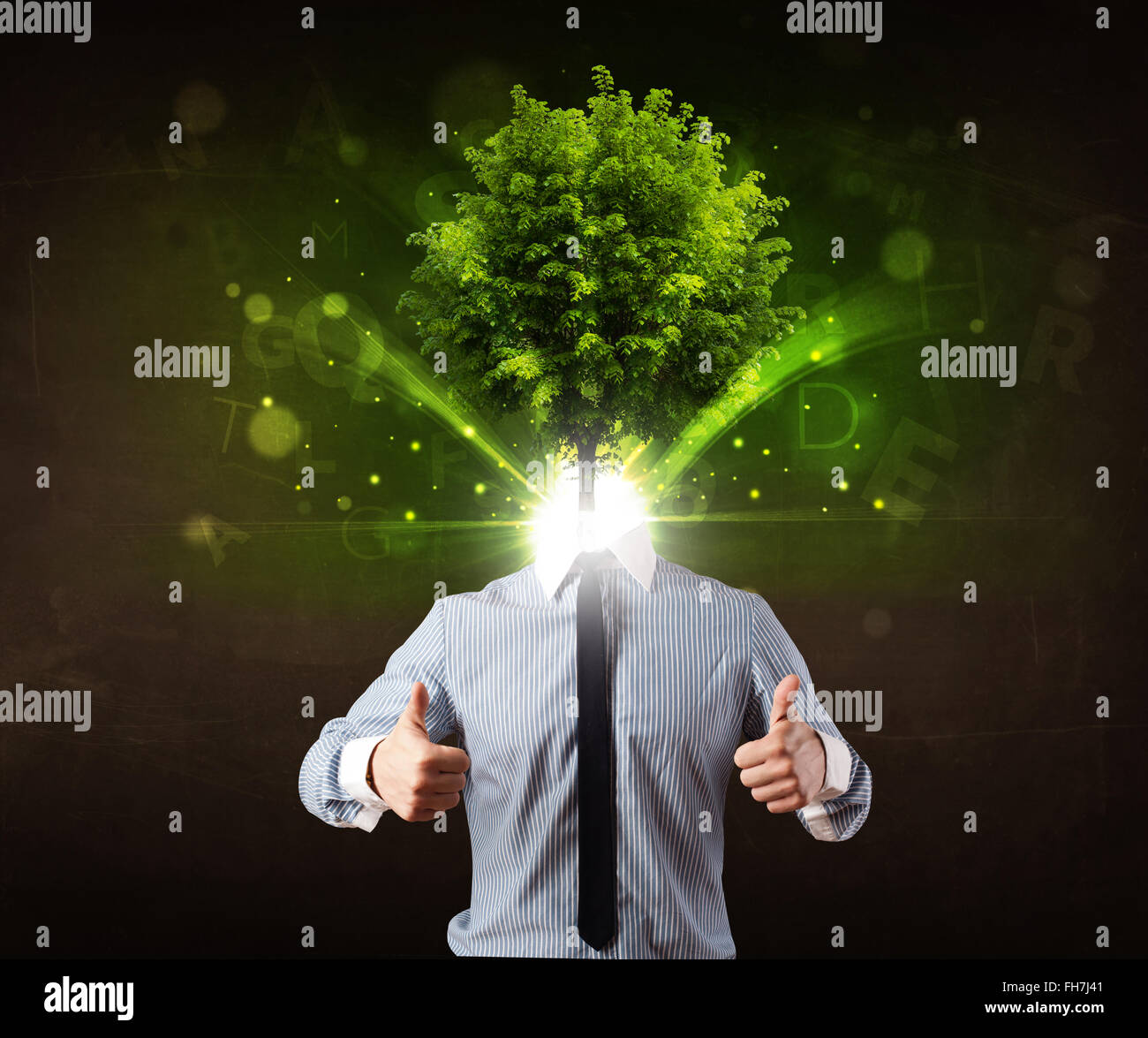 Man with green tree head concept Stock Photo - Alamy