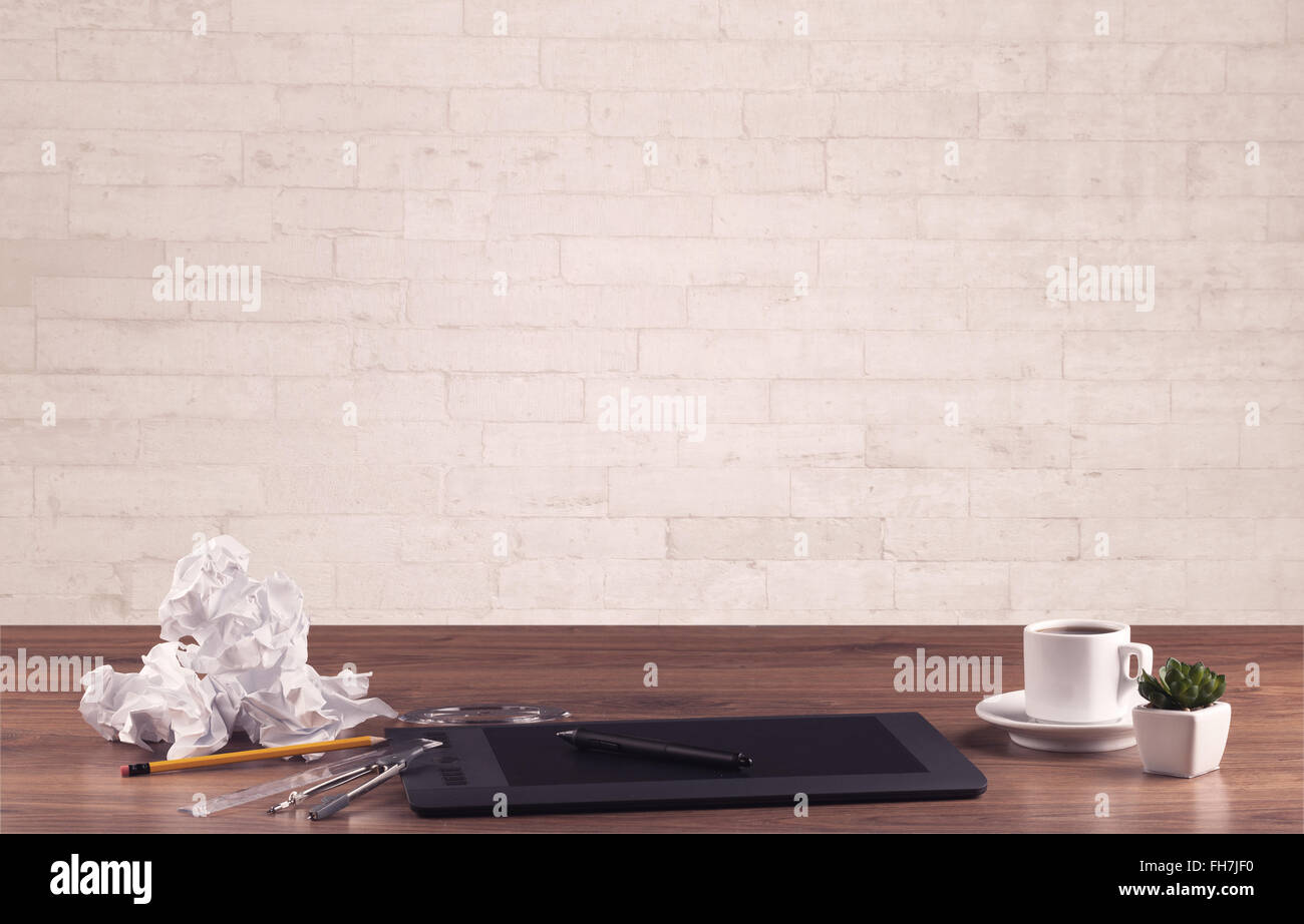 Office desk closeup with white brick wall Stock Photo - Alamy