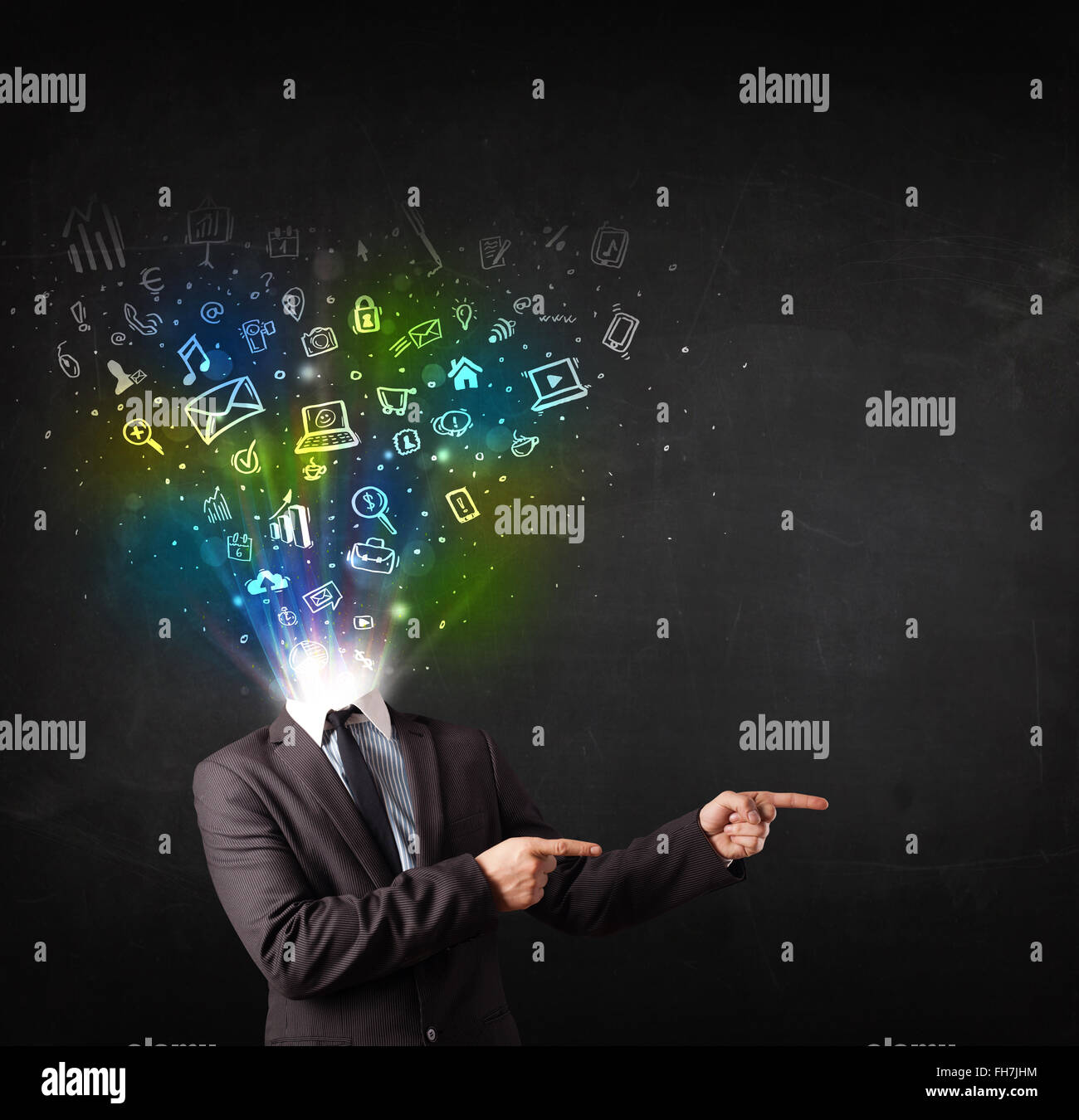Business man with glowing media icons exploding head Stock Photo - Alamy