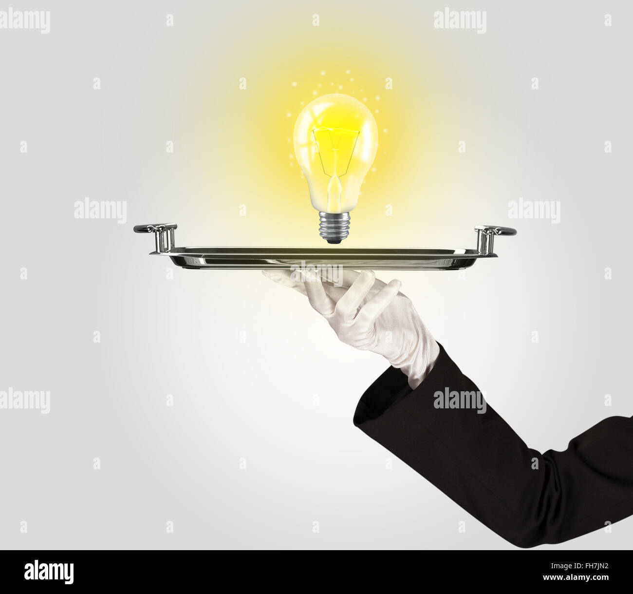 Clever idea concept with bulb on tray Stock Photo - Alamy
