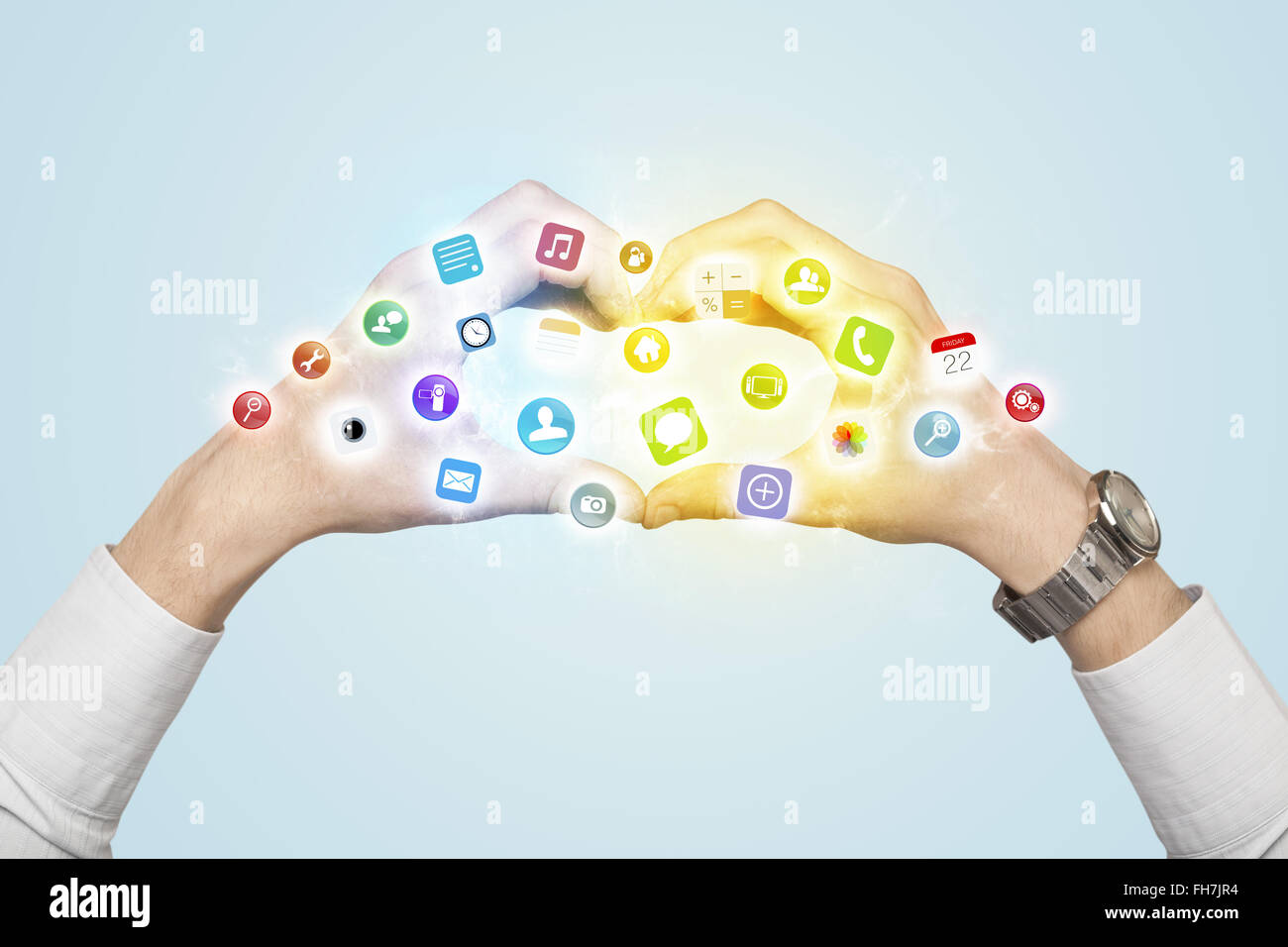 Hands creating a form with mobile app icons Stock Photo - Alamy