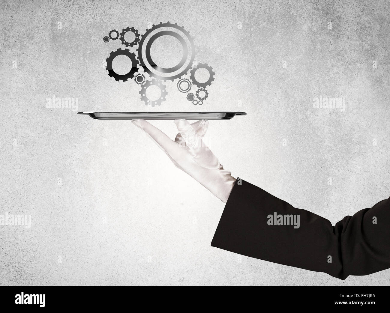 Working cog wheel concept on tray Stock Photo - Alamy