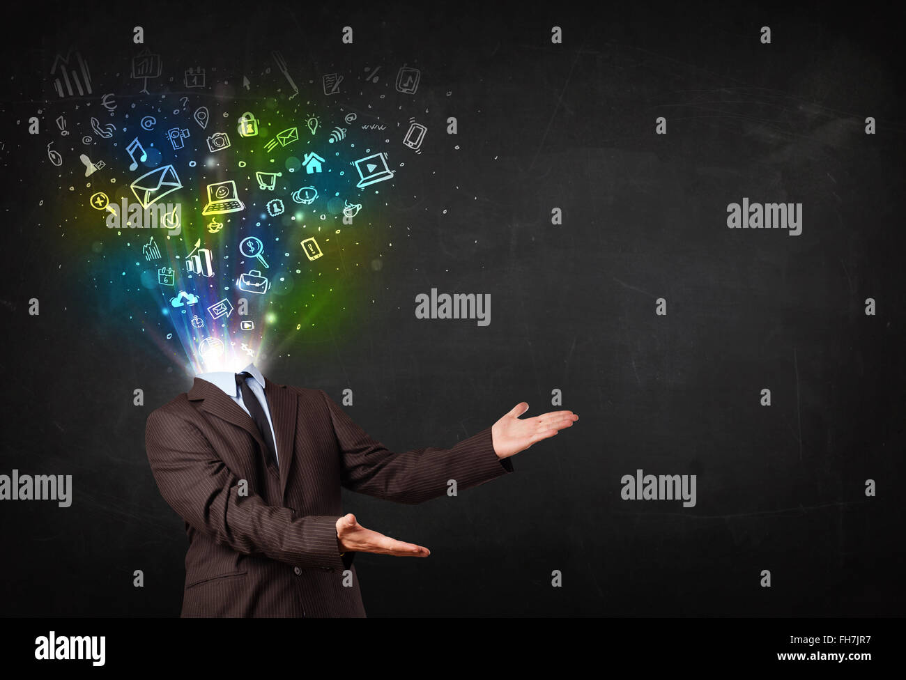 Business man with glowing media icons exploding head Stock Photo - Alamy