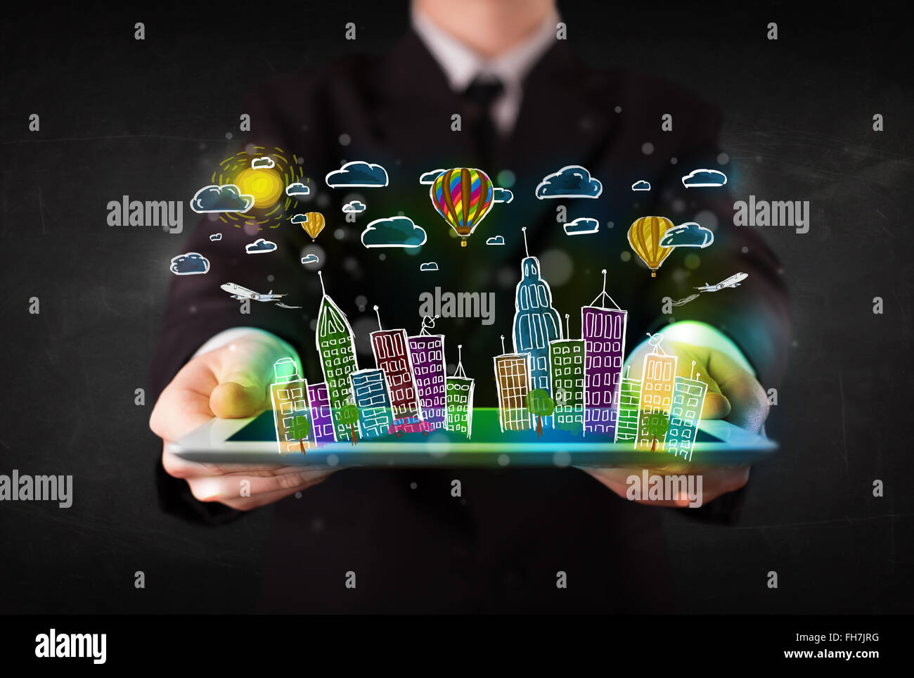 Young person showing tablet with hand drawn cityscape Stock Photo - Alamy