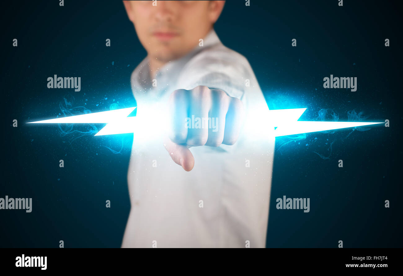 Business man holding glowing lightning bolt in his hands Stock Photo ...