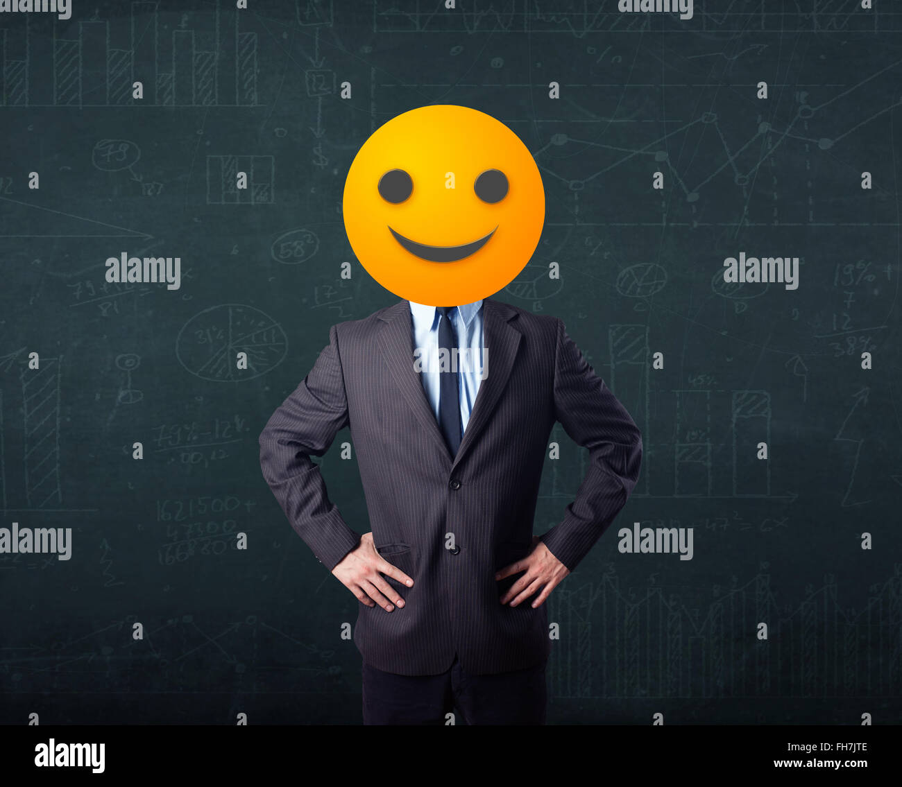 businessman wears yellow smiley face Stock Photo - Alamy