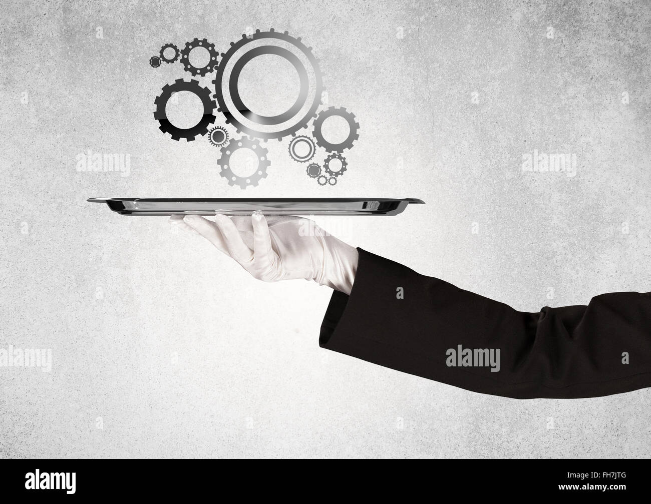 Working cog wheel concept on tray Stock Photo - Alamy