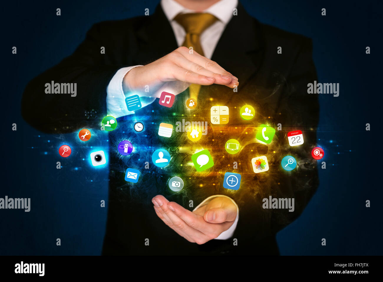 Businessman holding app icon cloud Stock Photo - Alamy