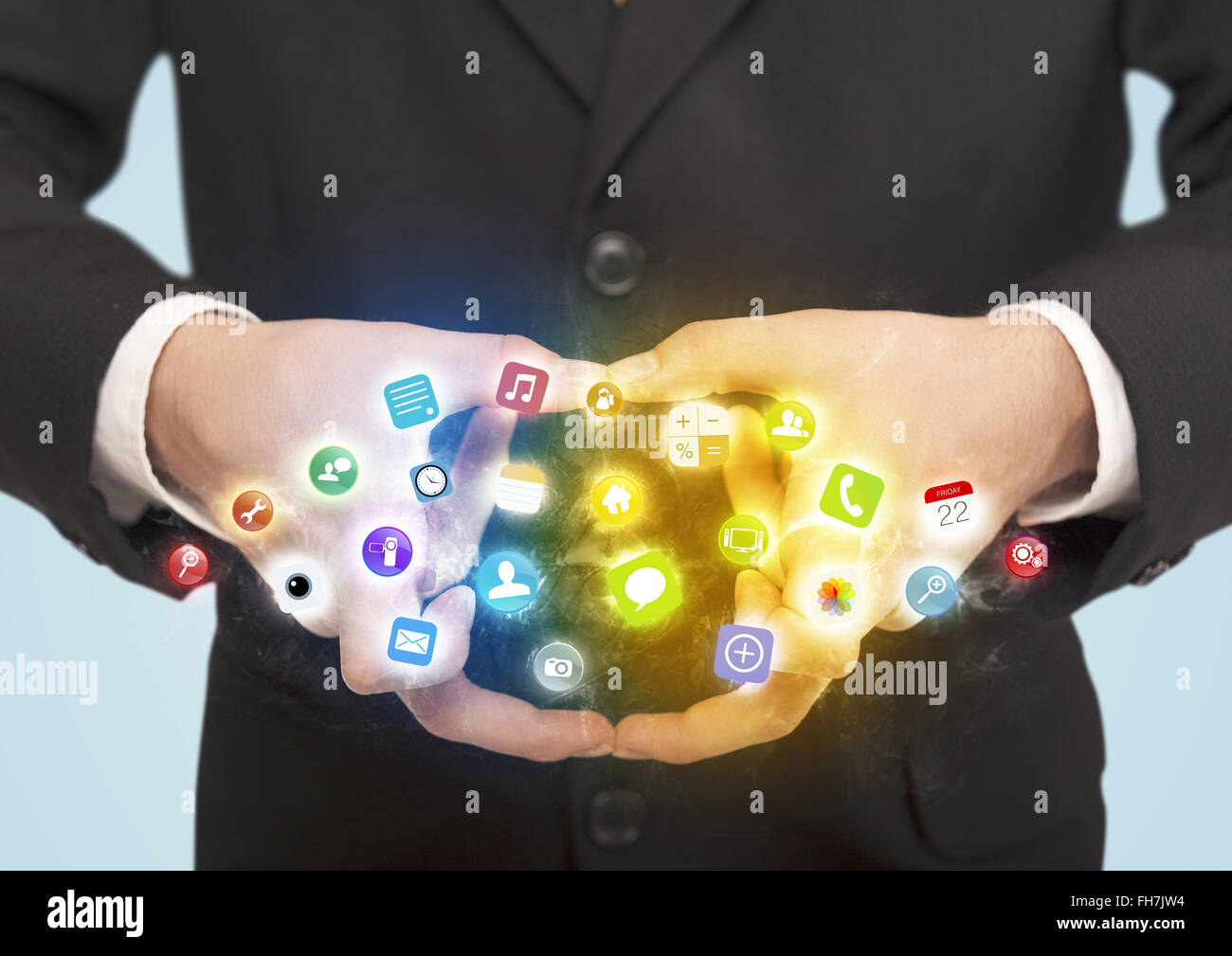 Hands creating a form with mobile app icons Stock Photo - Alamy