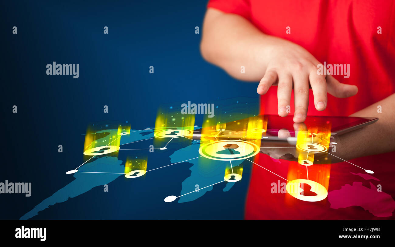 Hand holding tablet device with social network map Stock Photo - Alamy