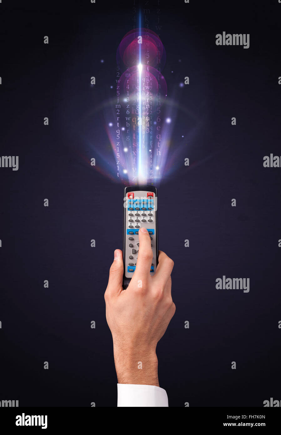 Hand with remote control and shining numbers Stock Photo - Alamy