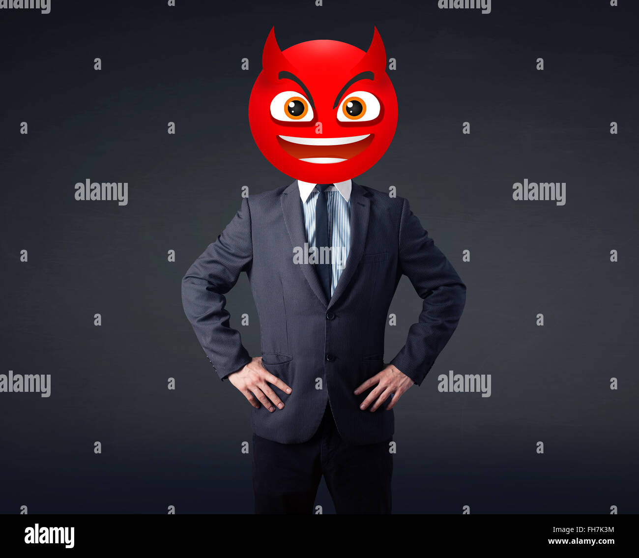 businessman wears devil smiley face Stock Photo - Alamy