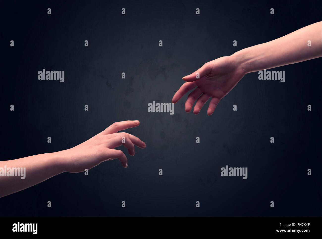 Hand about to touch another one Stock Photo - Alamy