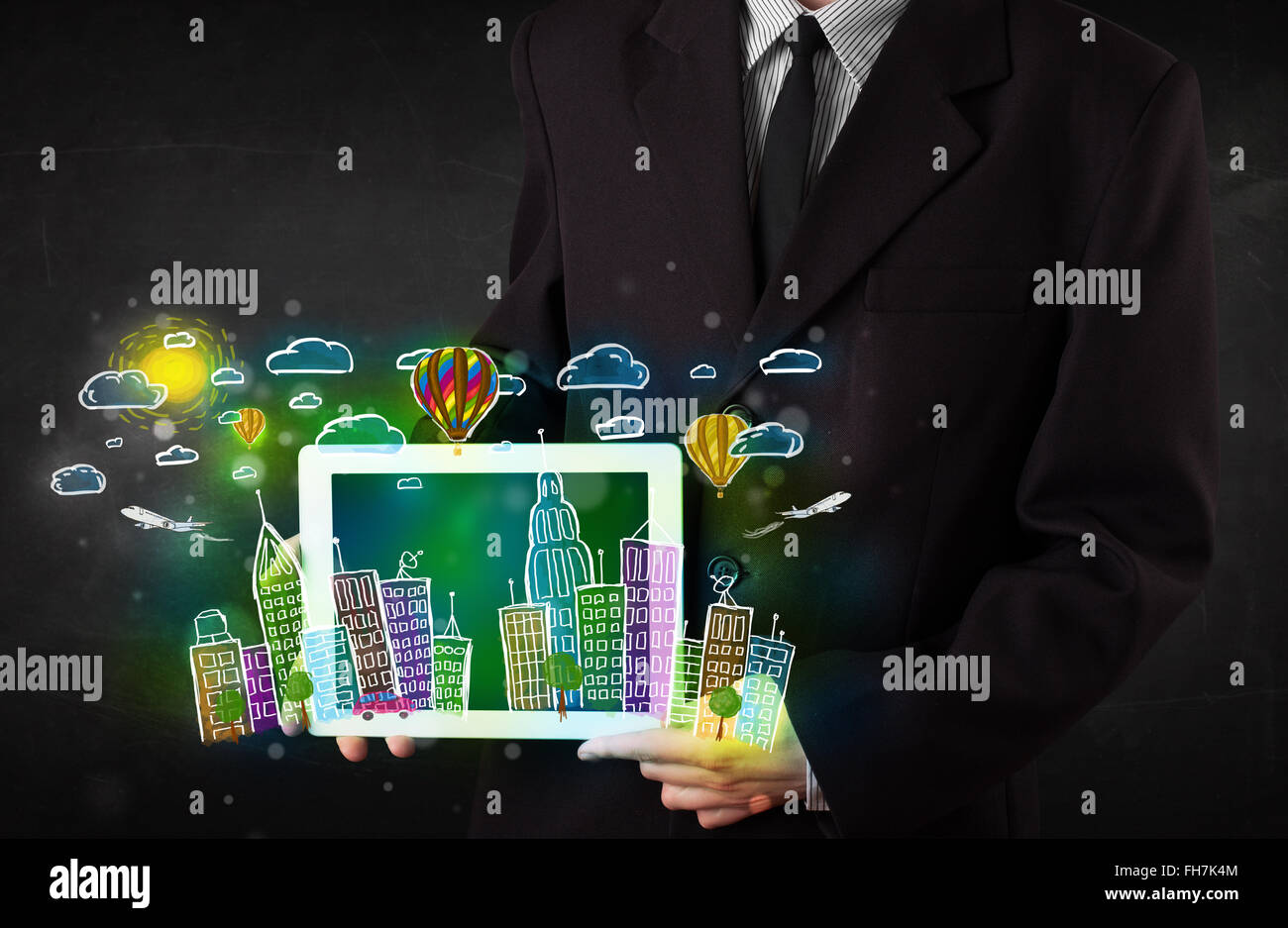 Young person showing tablet with hand drawn cityscape Stock Photo - Alamy