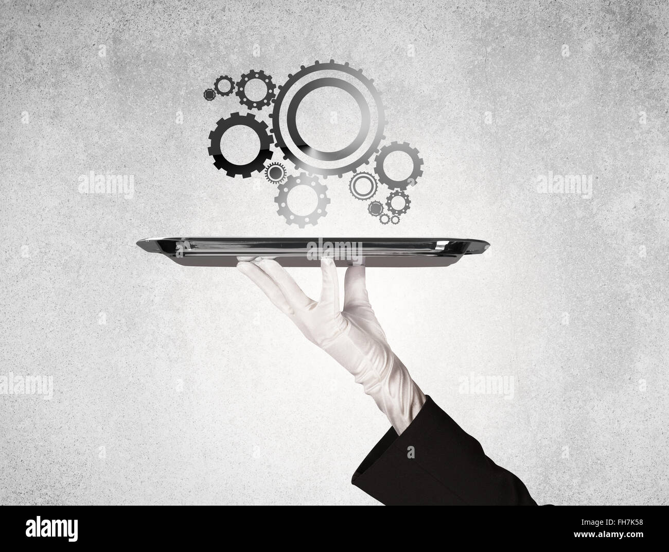 Working cog wheel concept on tray Stock Photo - Alamy