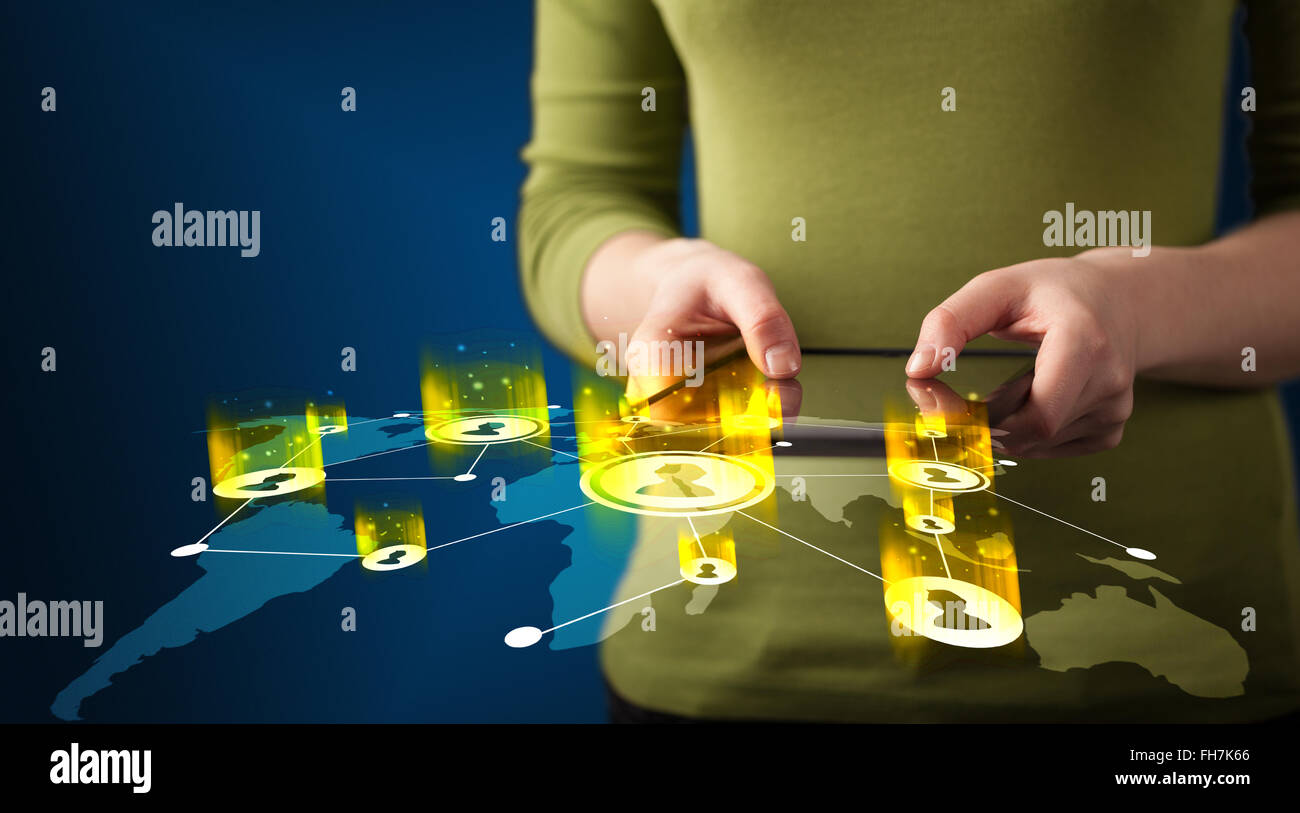 Hand holding tablet device with social network map Stock Photo - Alamy