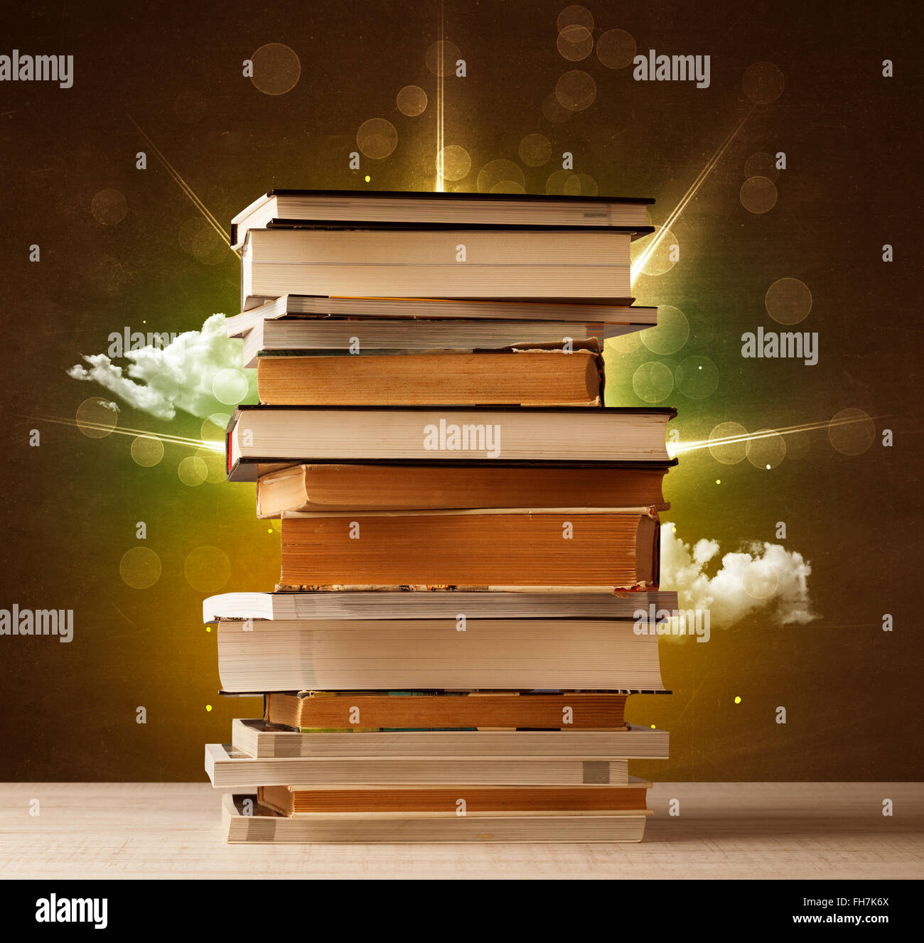 Magical books with ray of magical lights and colorful clouds Stock ...